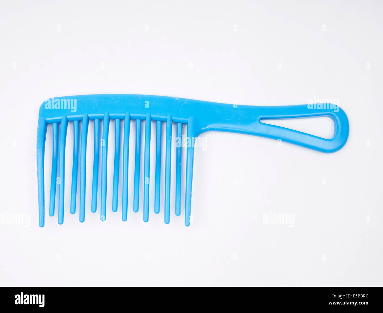 Blue plastic comb cut out isolated on white background Stock Photo - Alamy