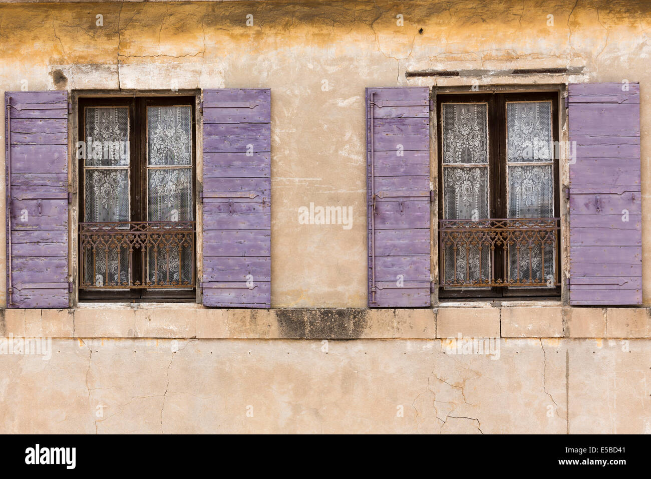 Two windows with lilac shutters Stock Photo - Alamy