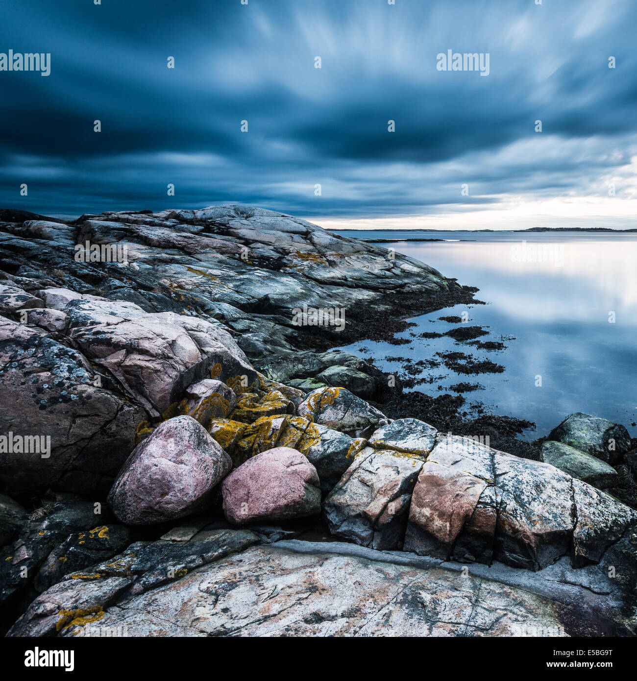 Rocky coastline with dramatic sky Stock Photo - Alamy