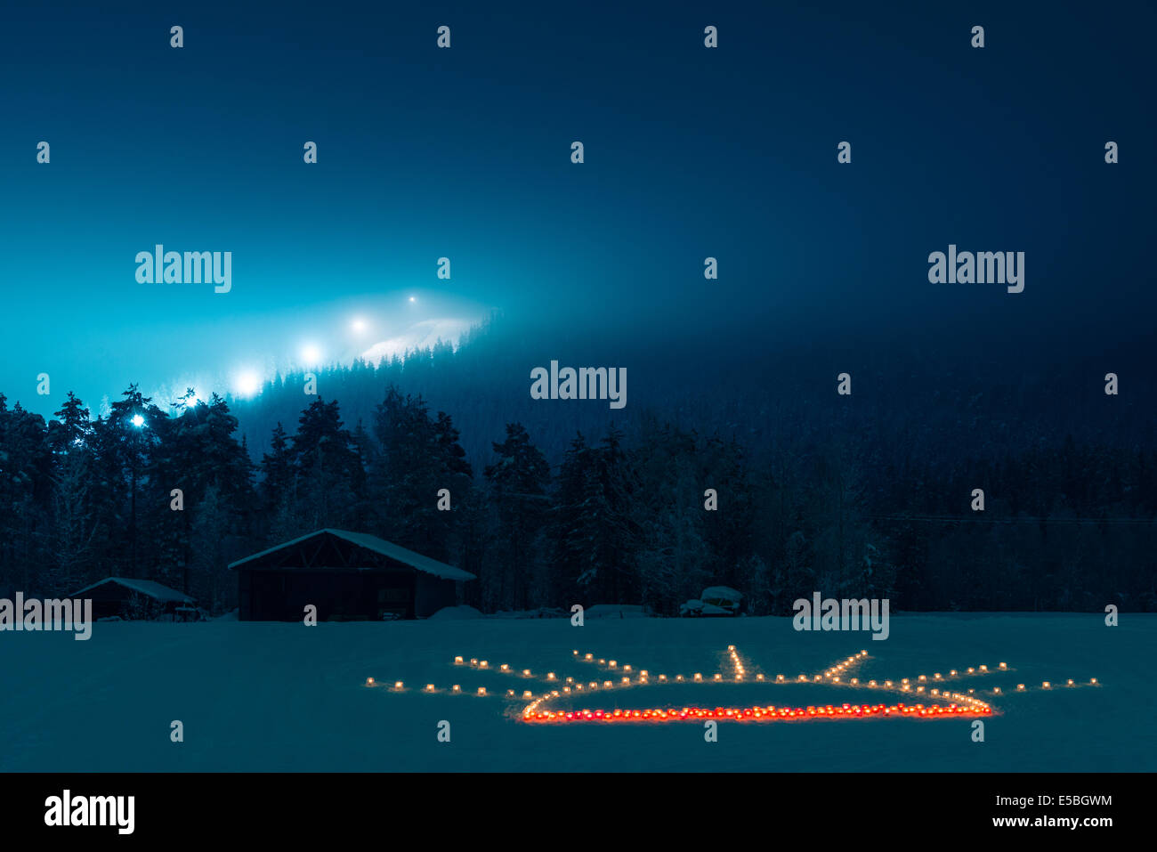 Candlelight decoration on snowy landscape at night Stock Photo - Alamy
