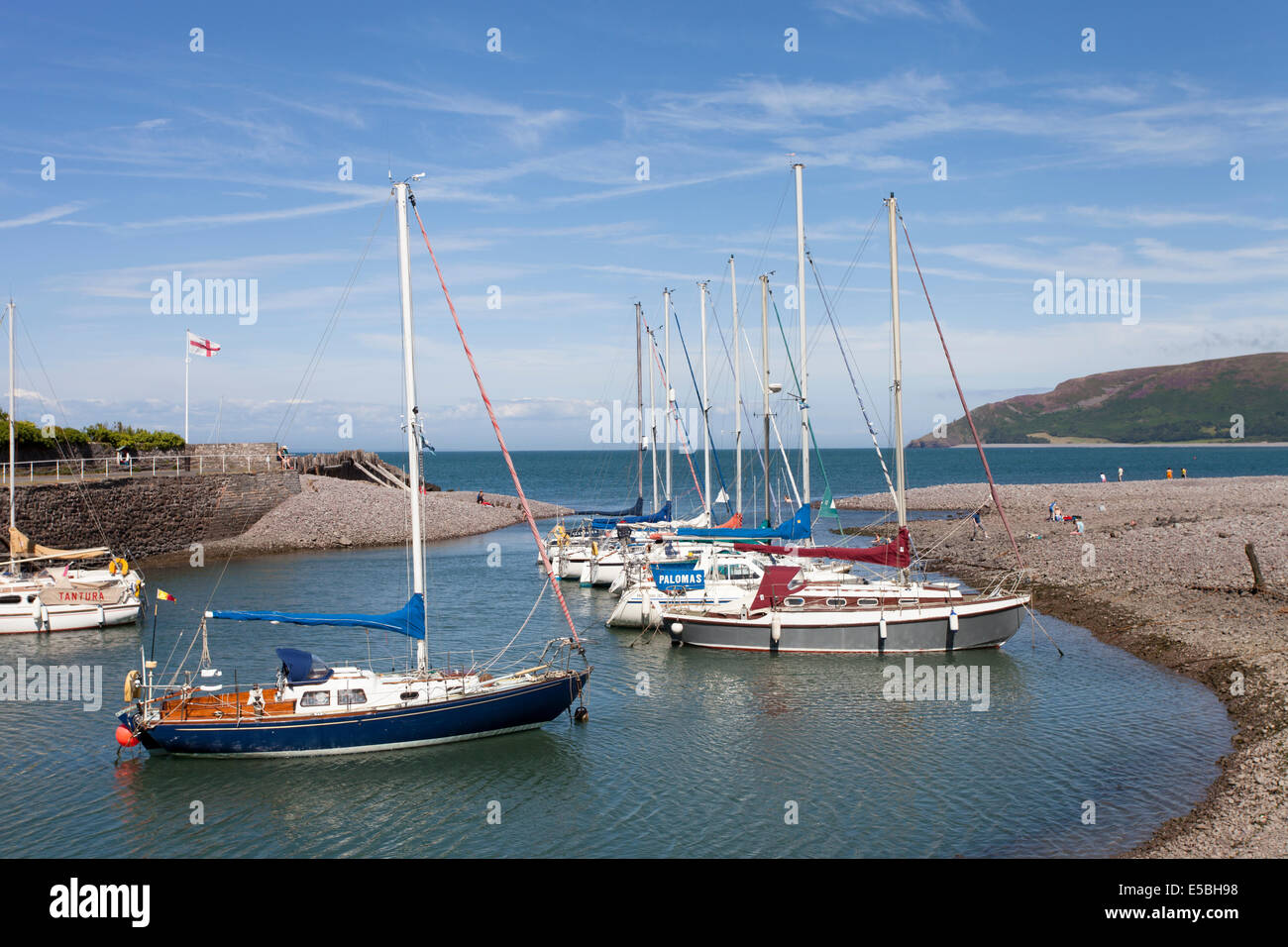 Yachts moored in a small seaside harbour - Porlock Weir, a popular ...