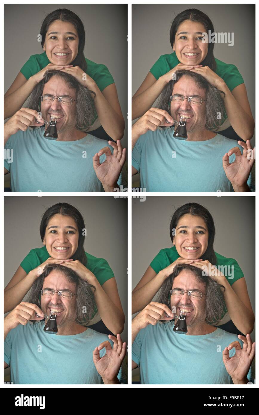 Couple having fun in a photo booth Stock Photo - Alamy