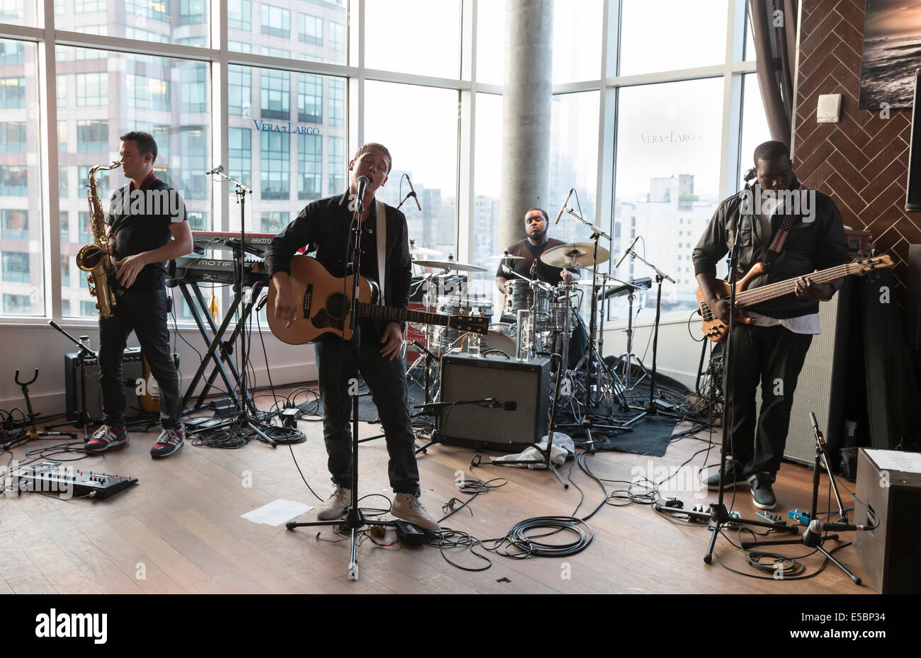 NEW YORK, NY - JULY 24, 2014: Chris Cab and his band preform during ...