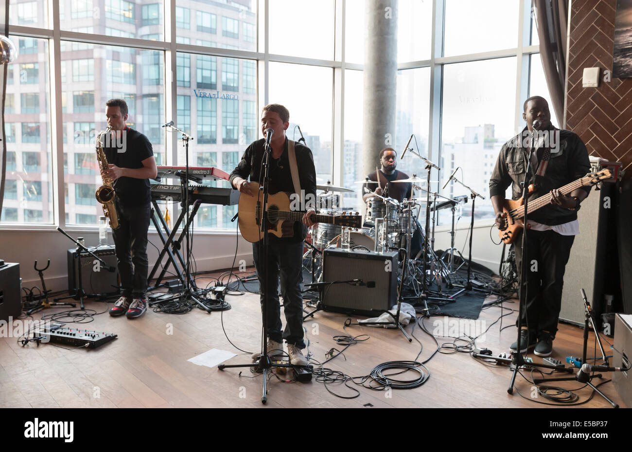 NEW YORK, NY - JULY 24, 2014: Chris Cab and his band preform during ...