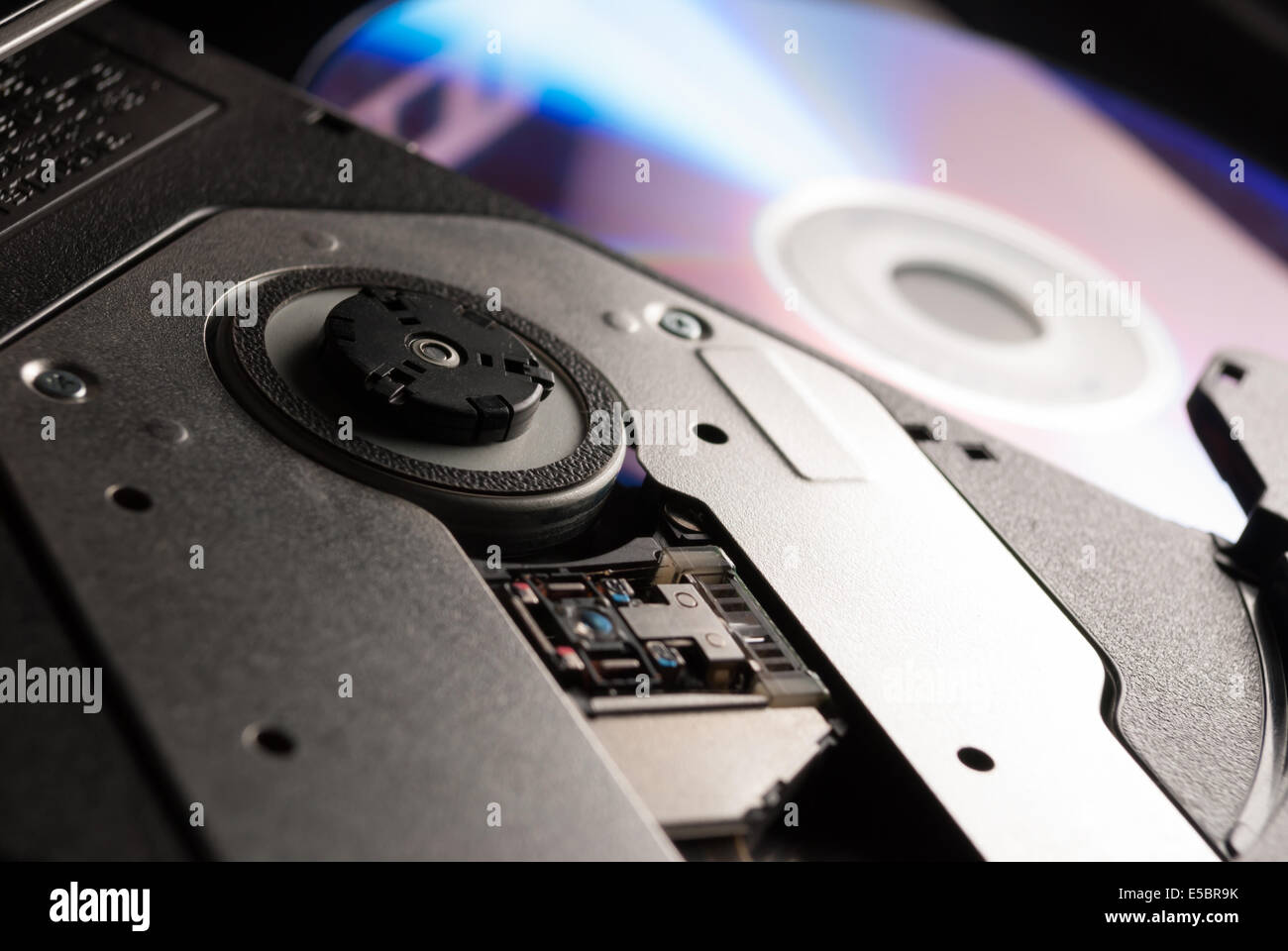 Compact disc drive with on black black background Stock Photo - Alamy