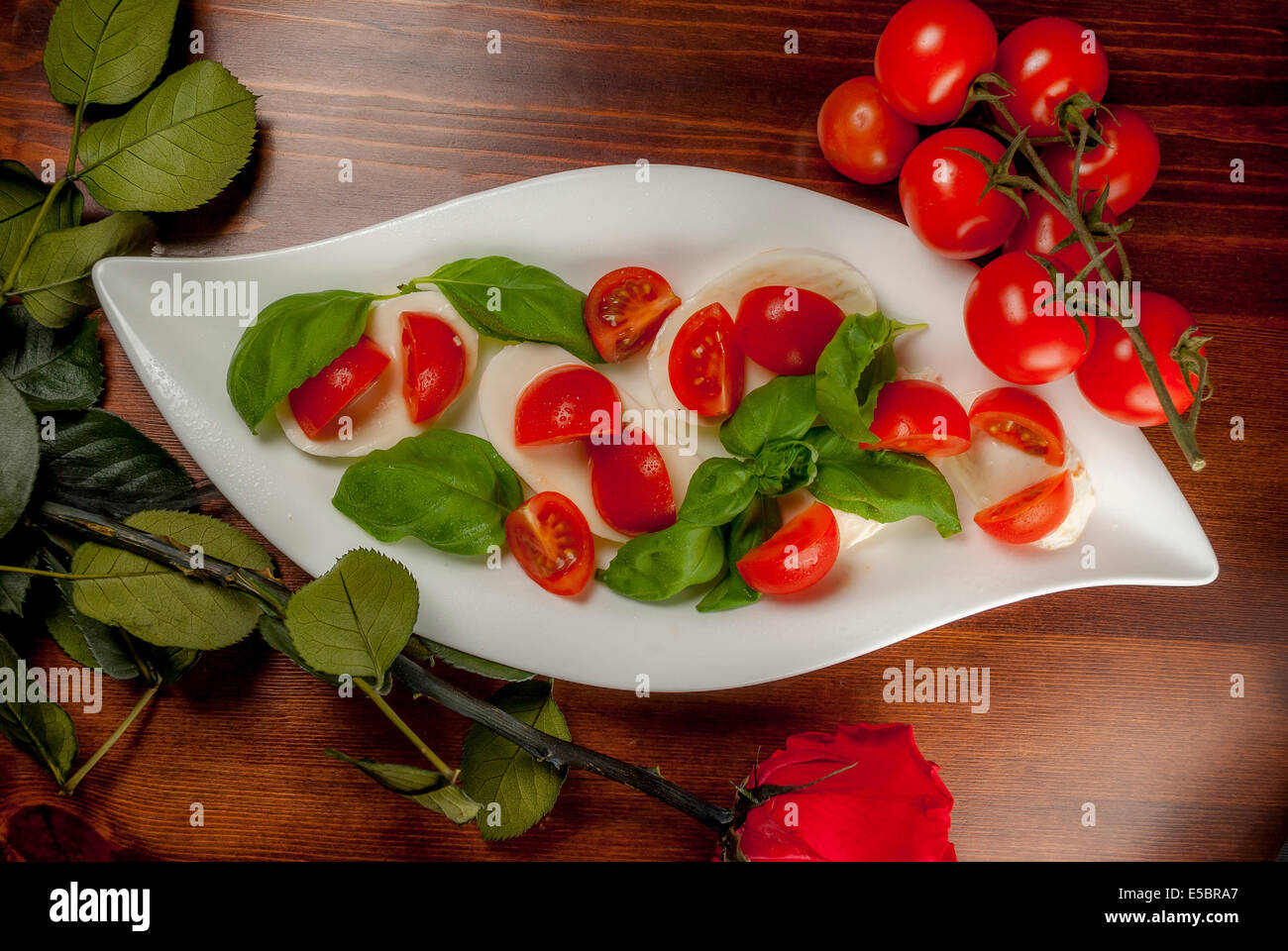 classic caprese salad with tomato and mozzarella and basil Stock Photo ...