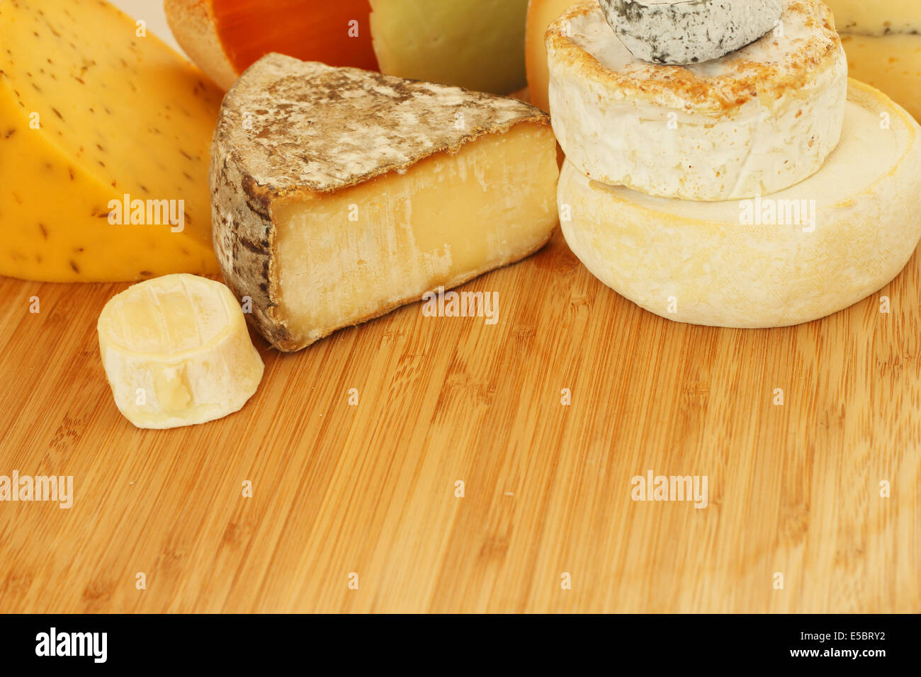 French cheese collection on wooden board with copy space Stock Photo ...
