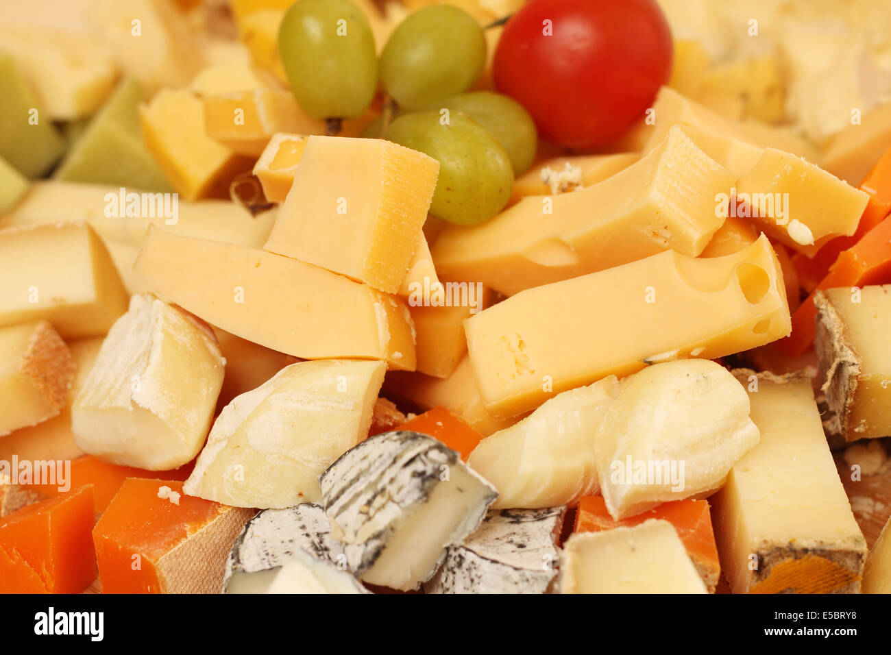 Cut french cheese blocks background close-up Stock Photo - Alamy