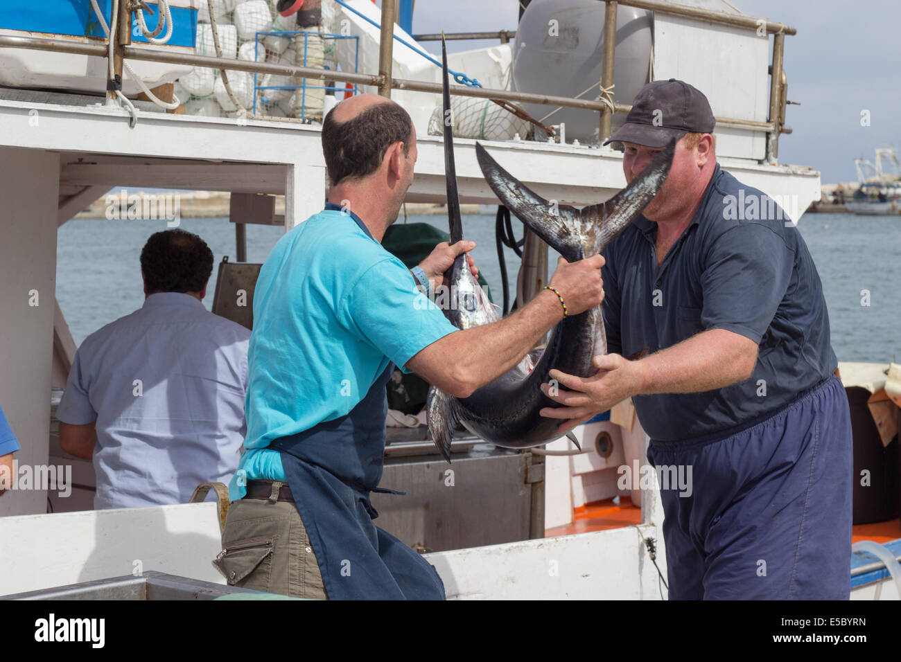 "commercial fishing" men fishermen swordfish holding vessel boat Stock Photo - Alamy