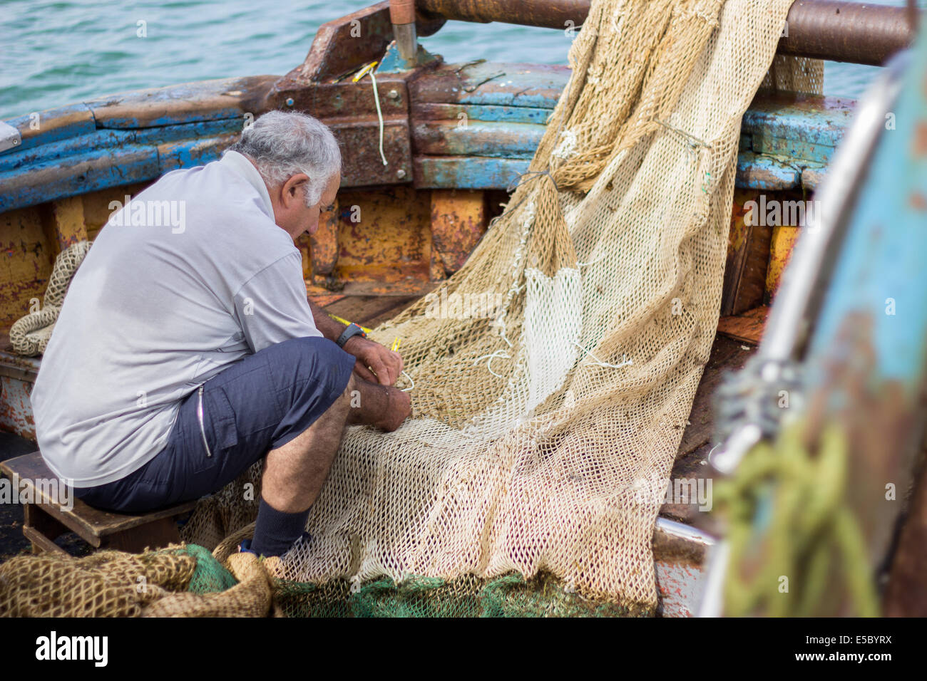 man weave weaving fishing net boat industrial working sea Stock Photo ...