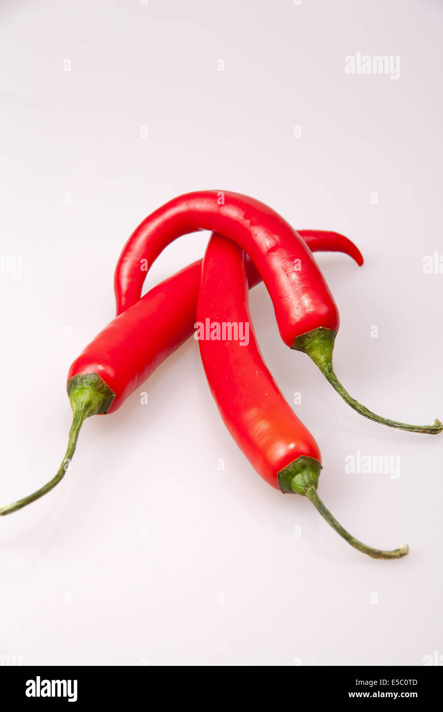 Three red chillies hi-res stock photography and images - Alamy