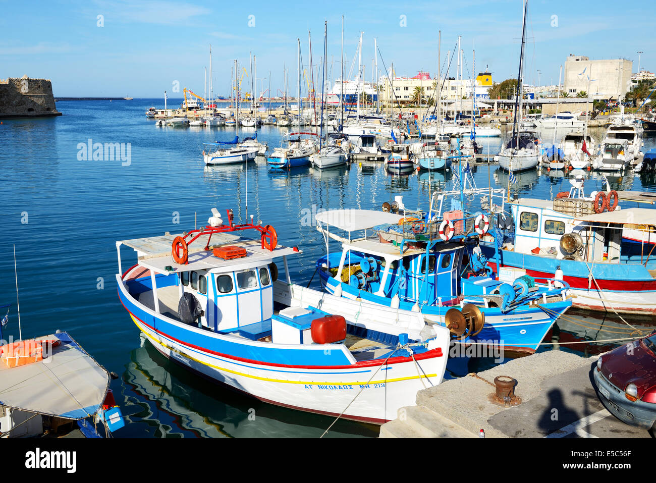 The traditional Greek fishing boat are near pier, Heraklion, Greece ...