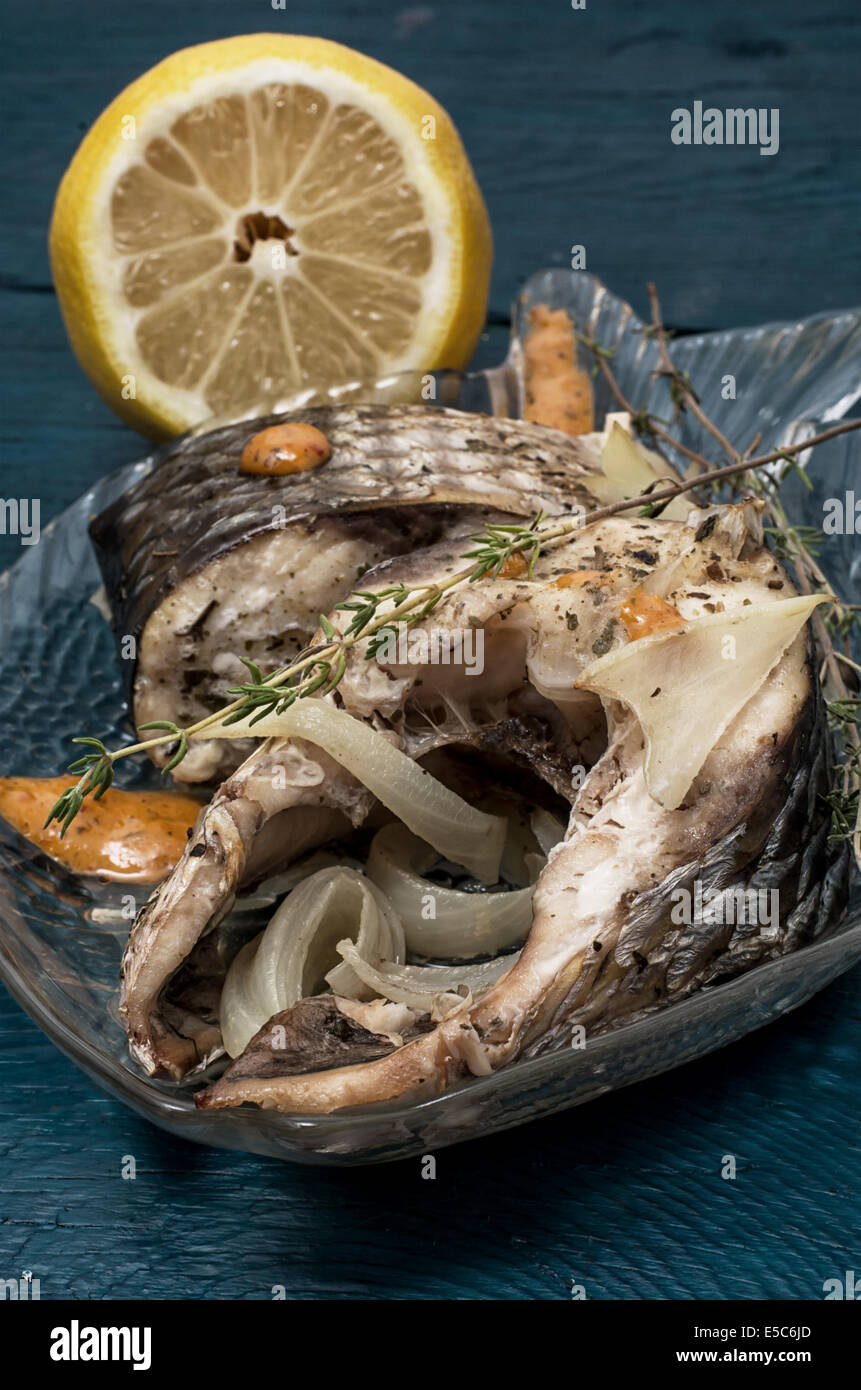 piece of fragrant roasted fish in sauce Stock Photo - Alamy