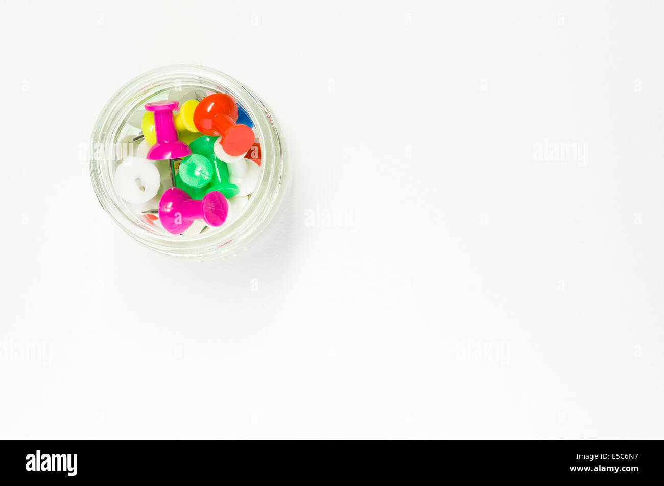 colored pins in a glass bin Stock Photo - Alamy