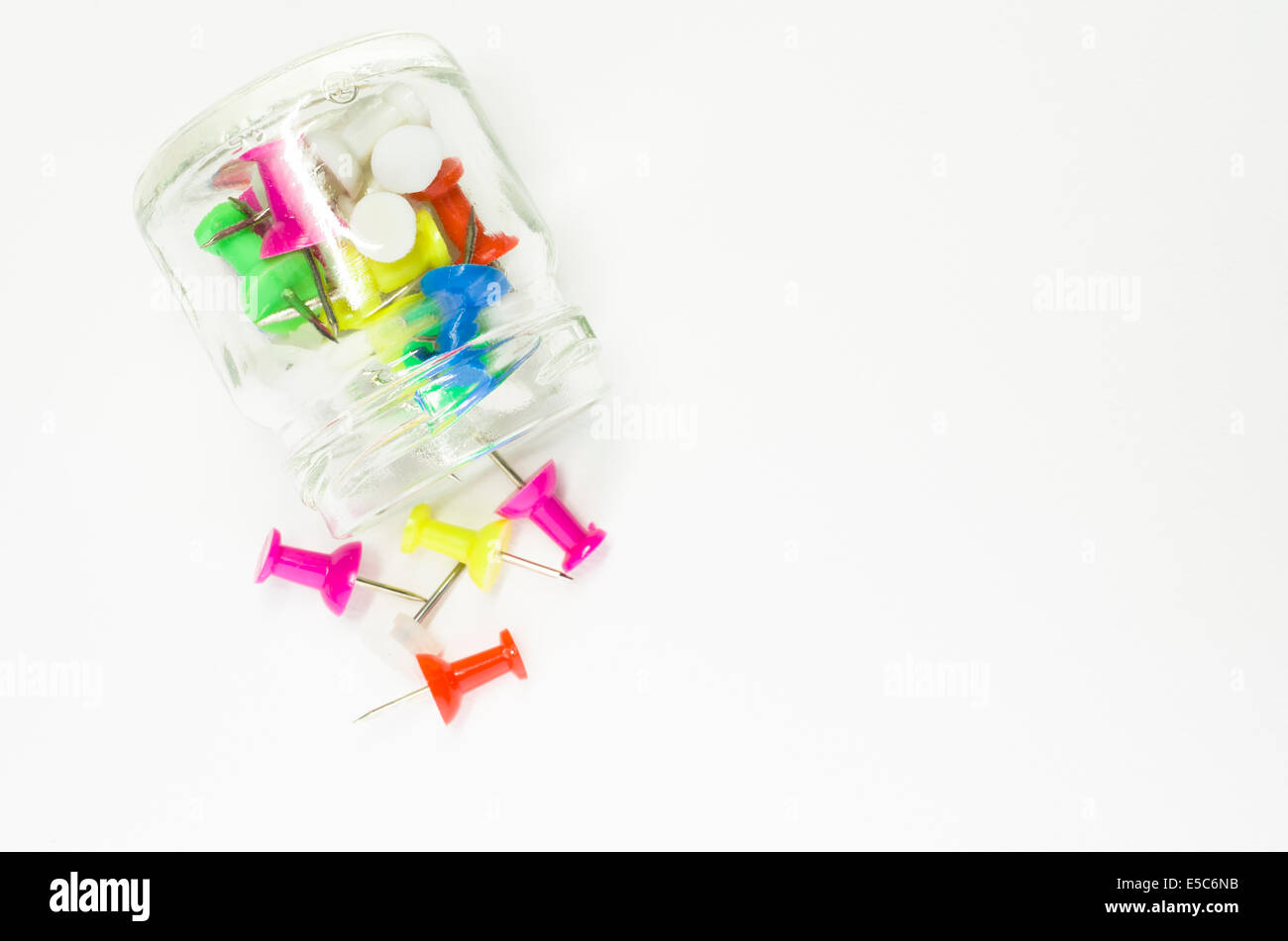 colored pins in a glass bin Stock Photo - Alamy