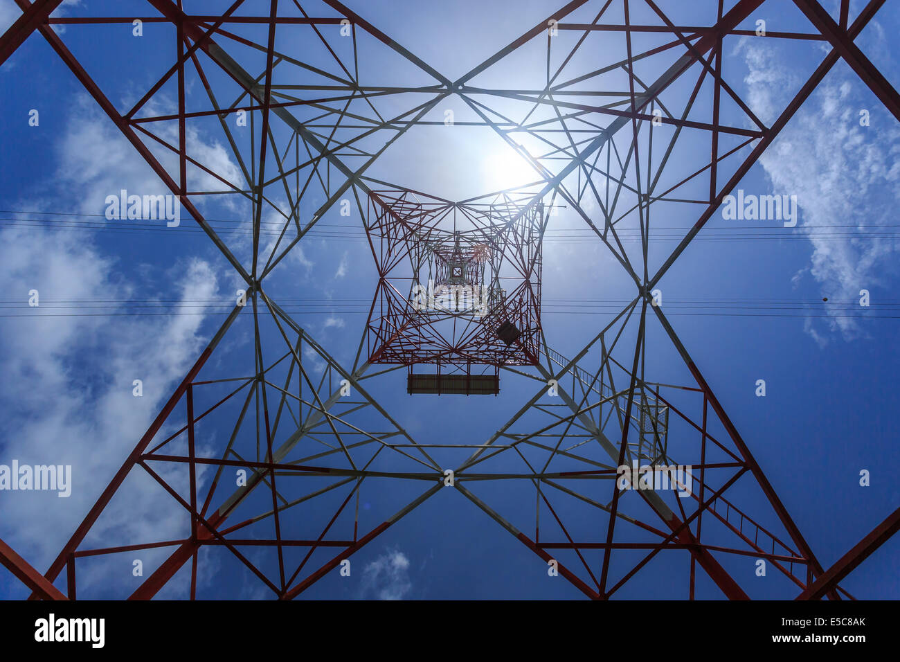 Super wide angle photograph of Electricity pylon with blue sky and sun ...