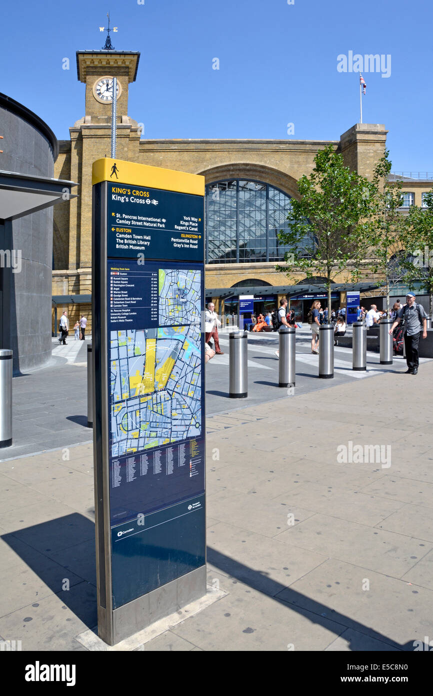 Legible London street sign with refurbished Kings Cross station facade ...