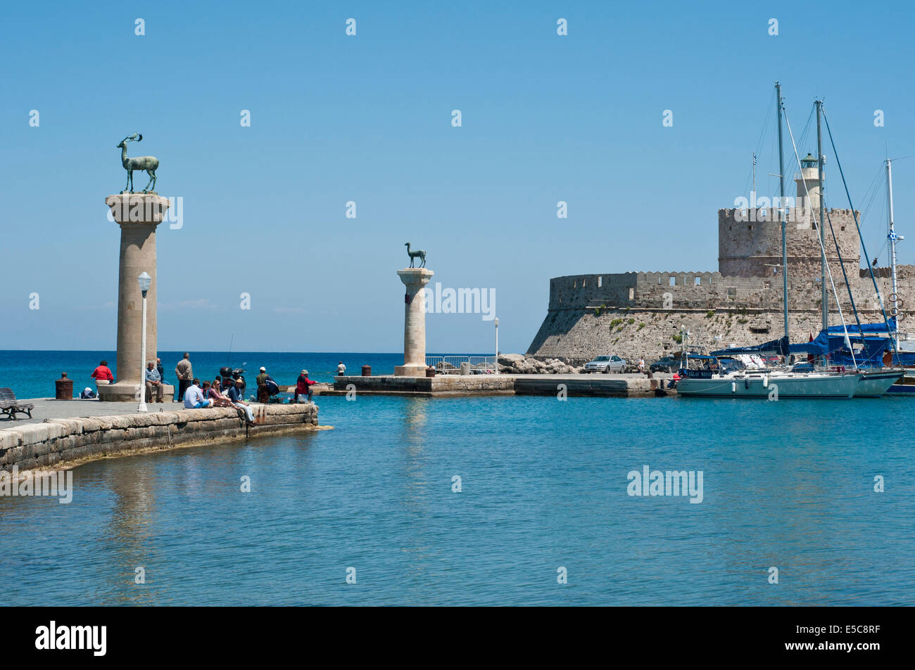 Entrance of the Mandraki Harbour Rhodes Greece Stock Photo - Alamy