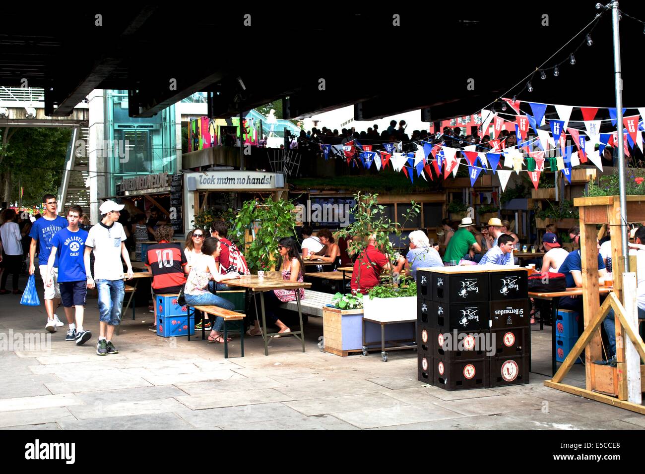 Urban style caravan Café under Embankment Bridge, London on a sunny day ...