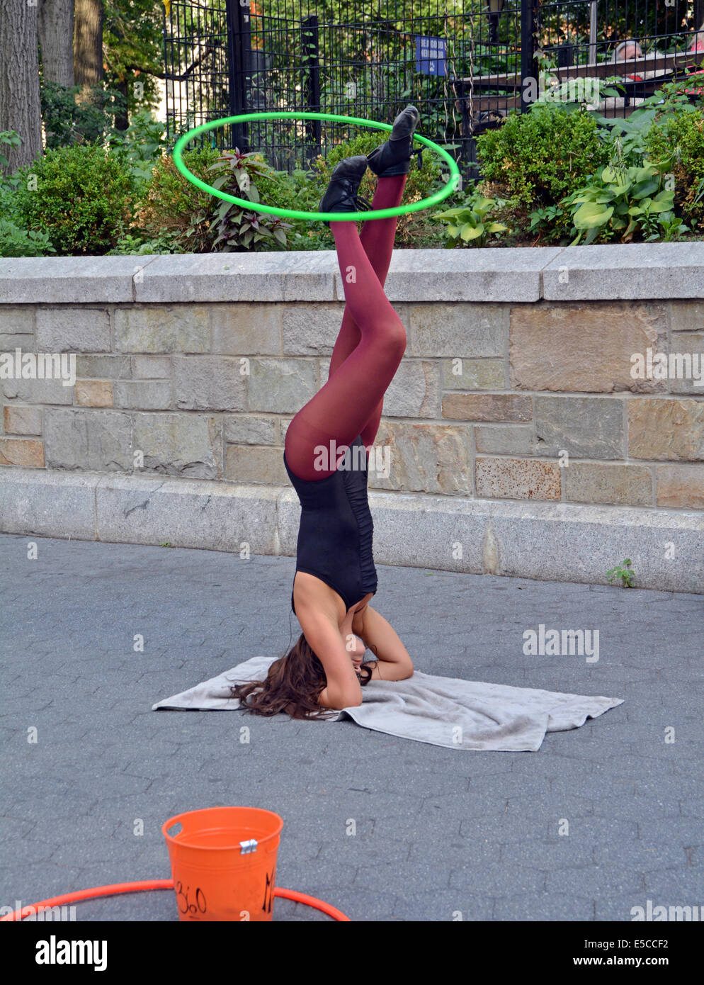 Miss 360 a street performance artist who works with hula hoops ...
