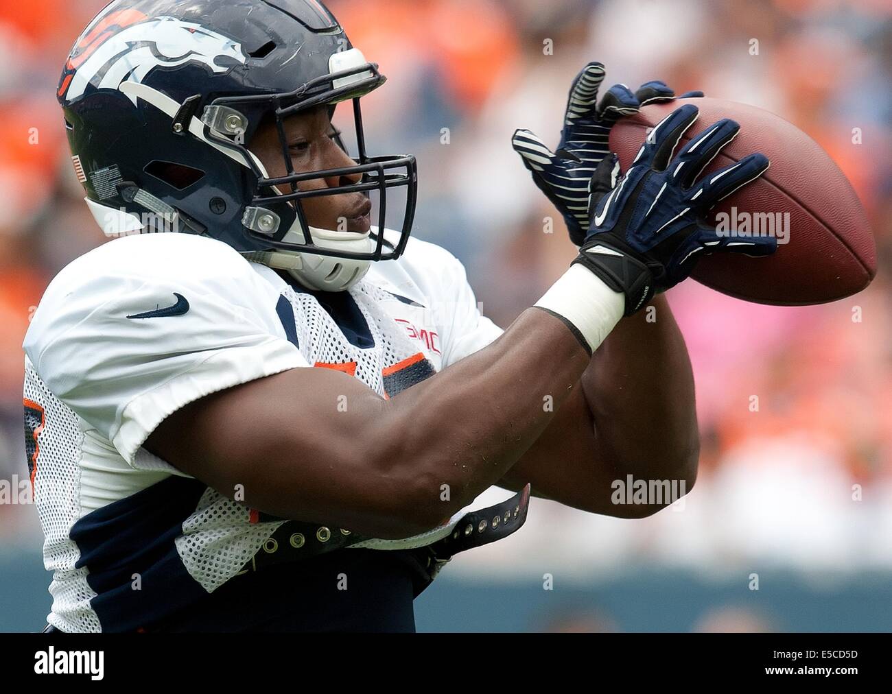 Denver, Colorado, USA. 27th July, 2014. Broncos LB COREY NELSON catches a pass during LB drills ...