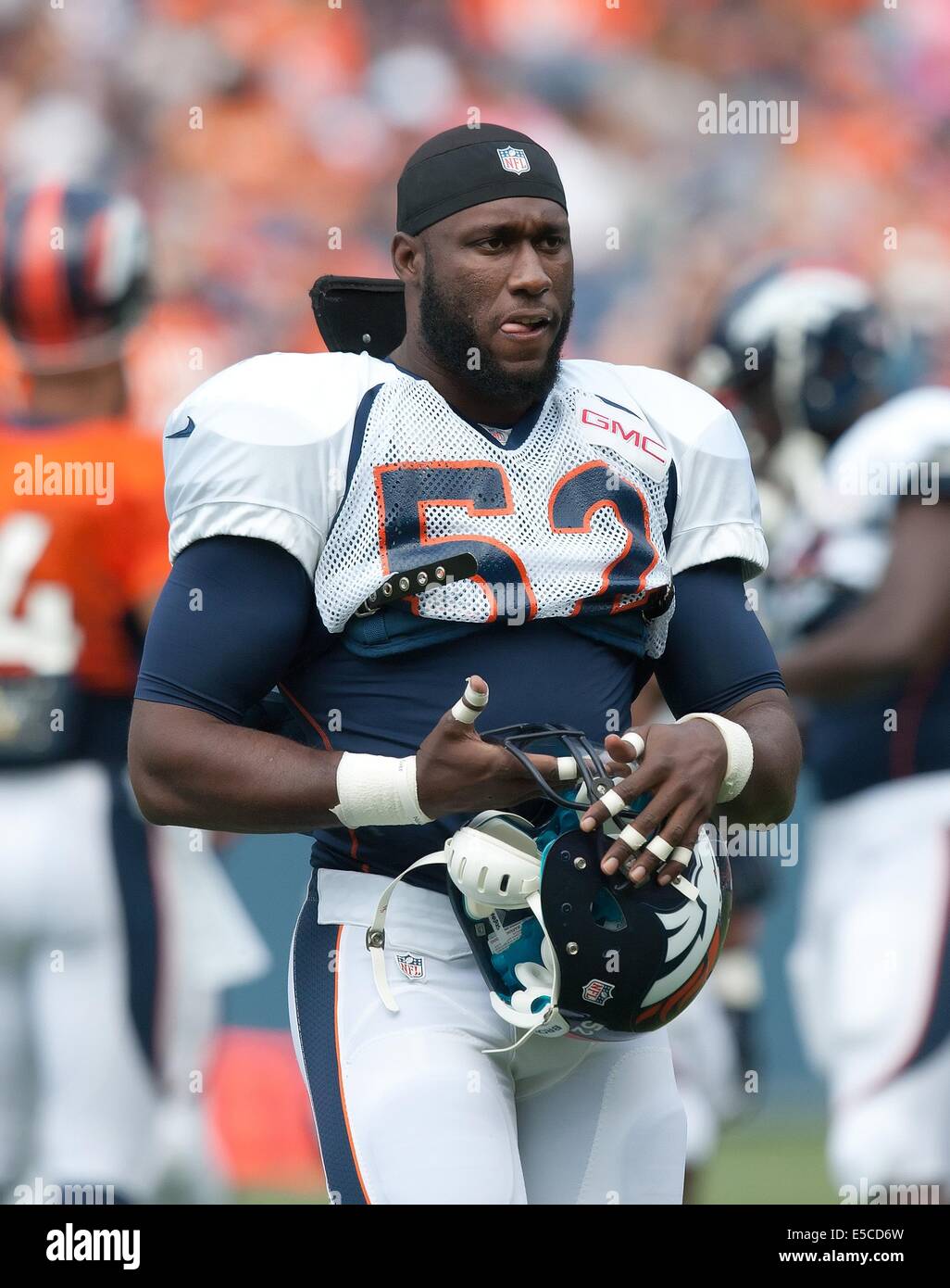Denver, Colorado, USA. 27th July, 2014. Broncos LB JERRELL HARRIS reads ...
