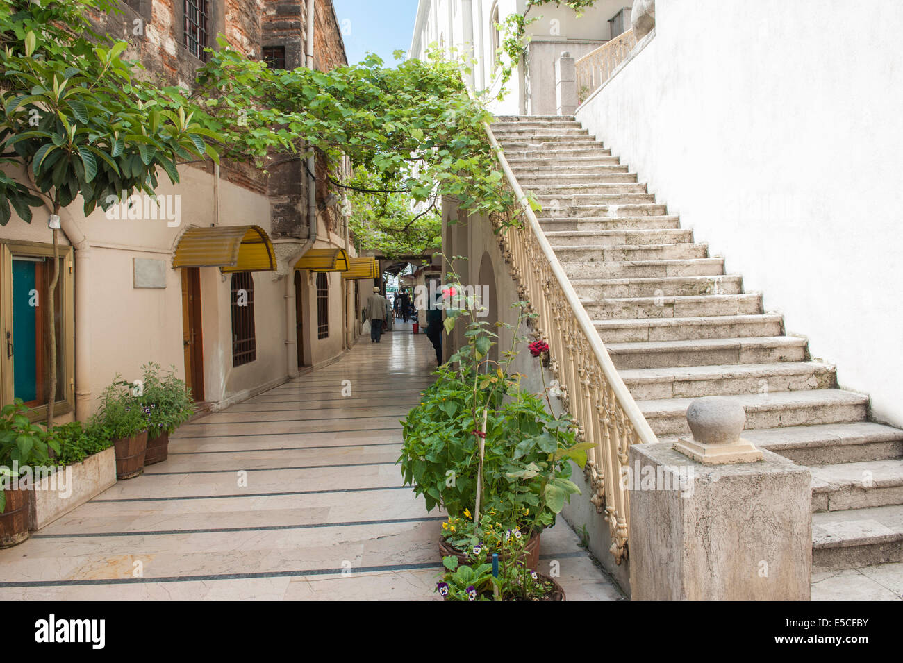 Old marble passageway in city center buildings with stone steps and ...