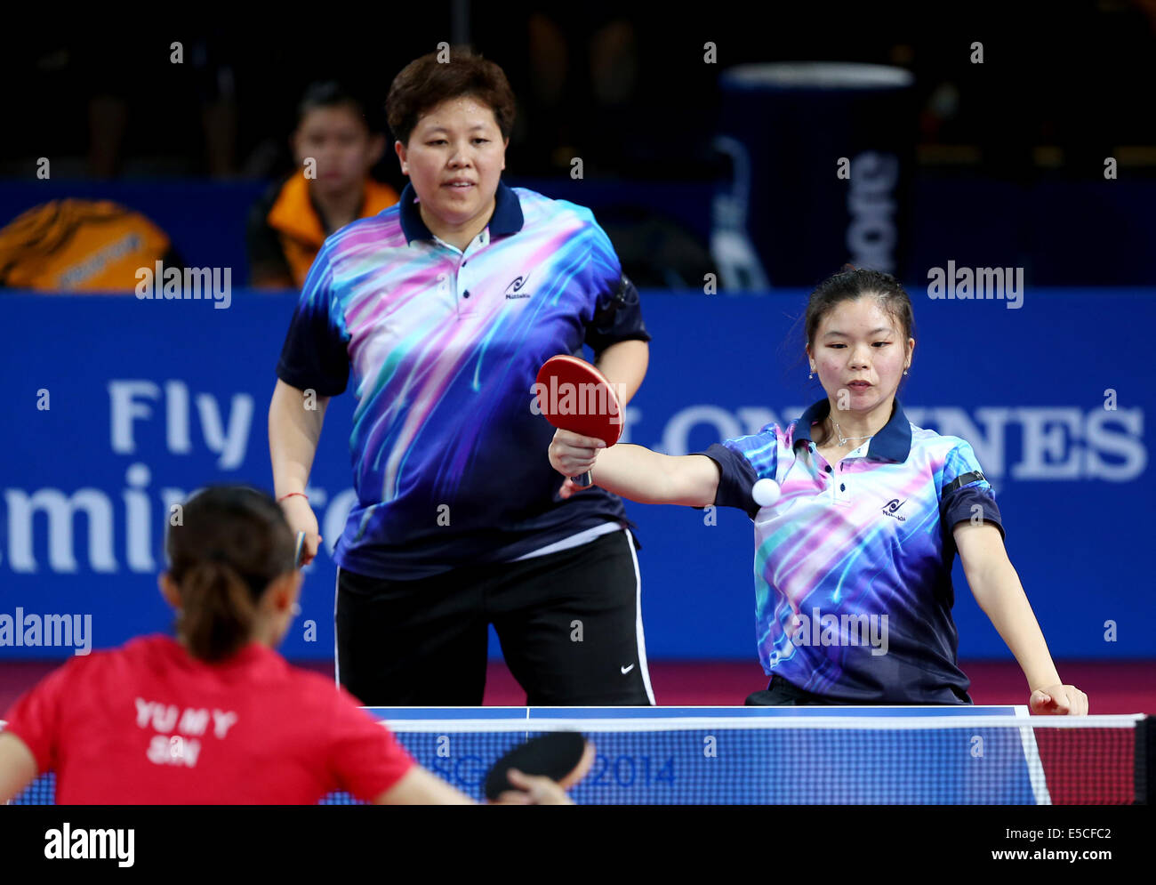 Glasgow, Scotland, UK. 27th July, 2014. Ho Ying (R)/Beh Lee Wei (C) of ...