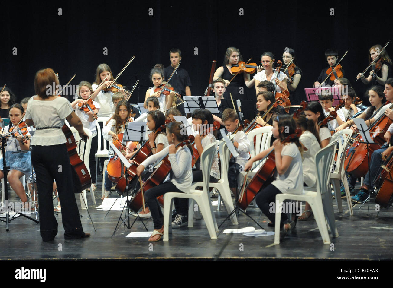 Students playing musical instruments hi-res stock photography and ...