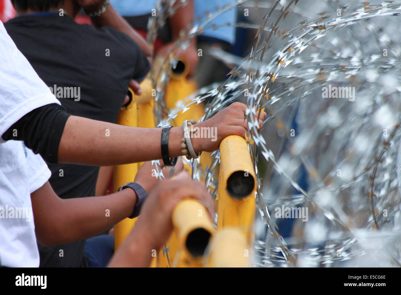 The protesters are holding the barricades set-up by the Philippine ...
