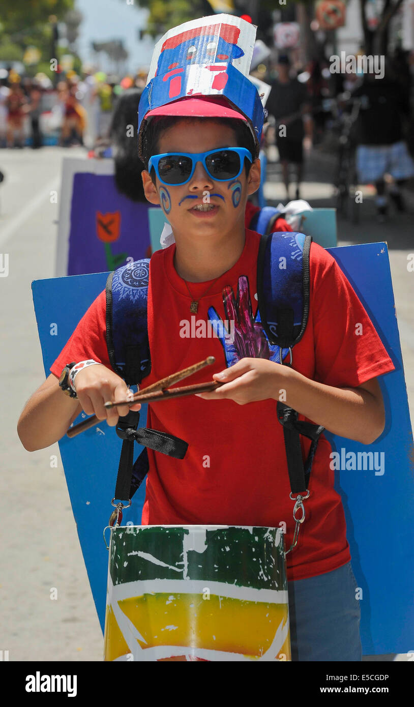A young drummer boy in a marching band participate in the 2014 Summer ...