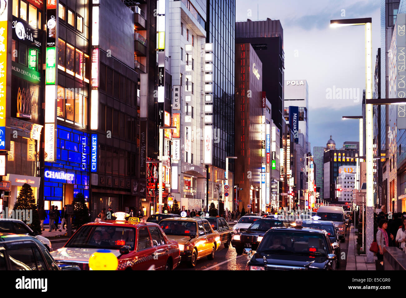 Tokyo city streets filled with taxi cabs at dusk. Ginza, Tokyo, Japan ...