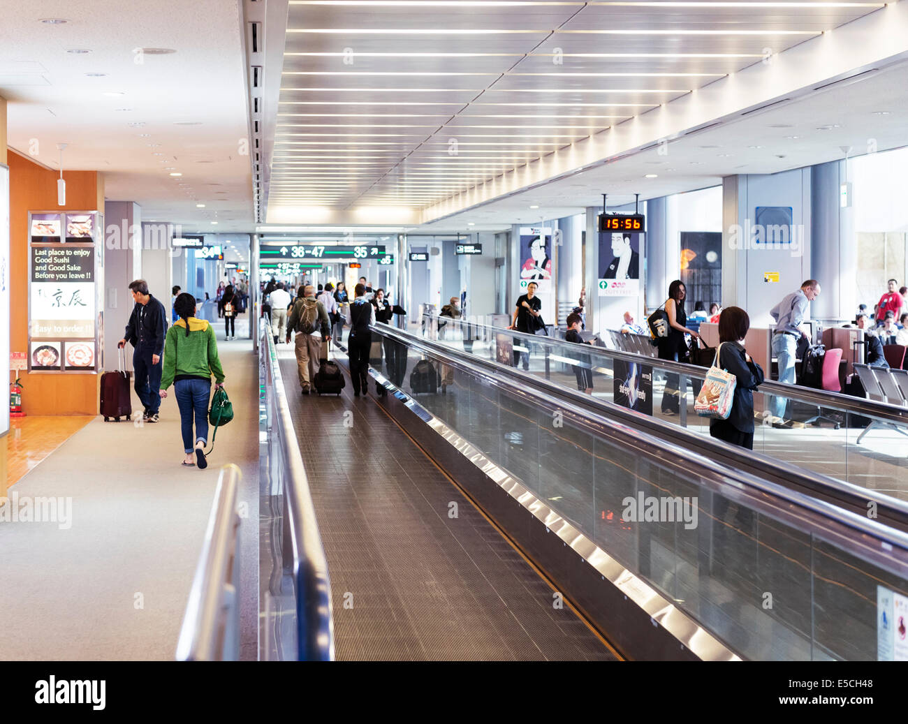 People on a moving walkway at Narita International airport, Japan Stock ...