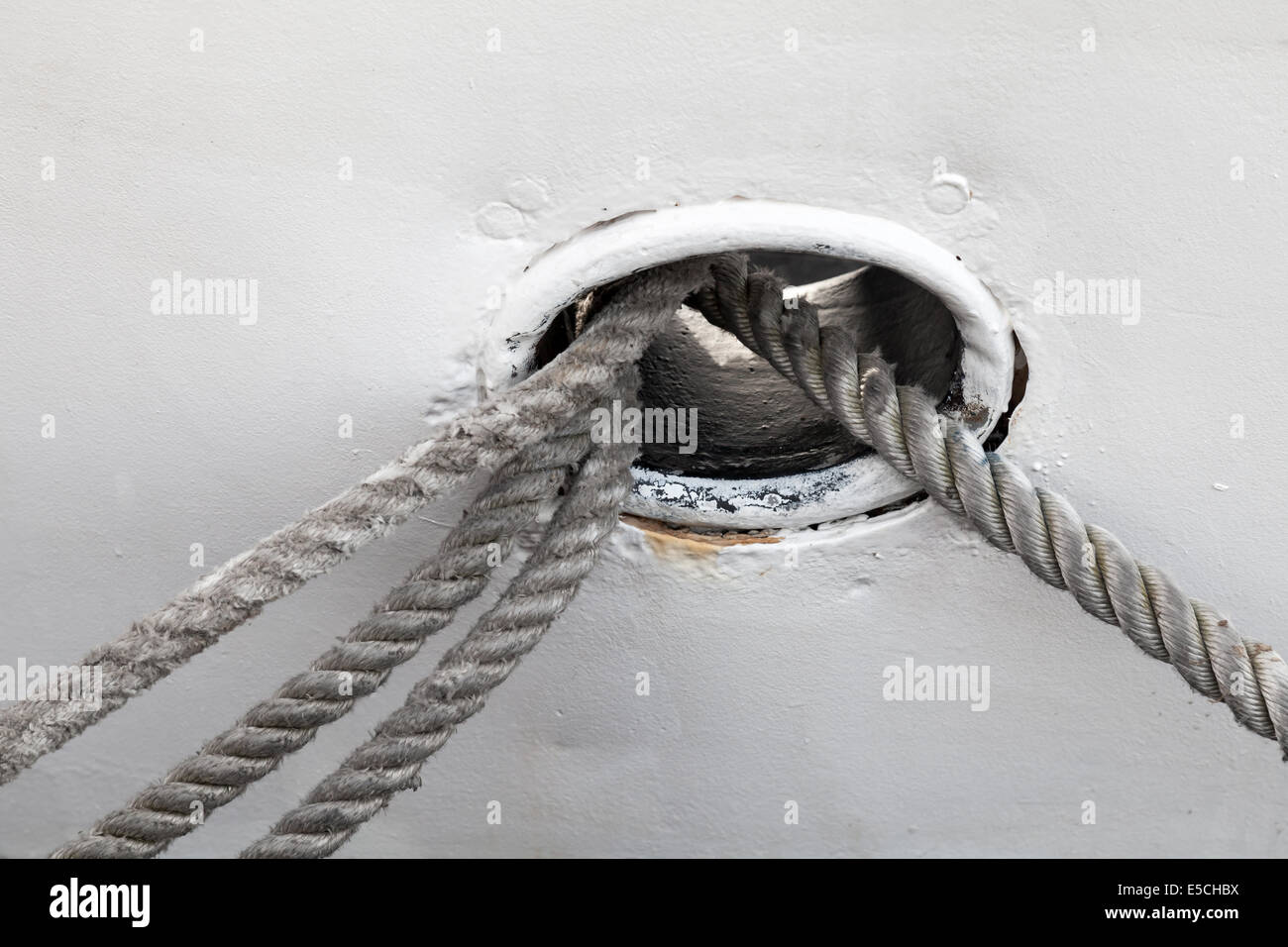 Hawse with ropes in white ship hull Stock Photo - Alamy