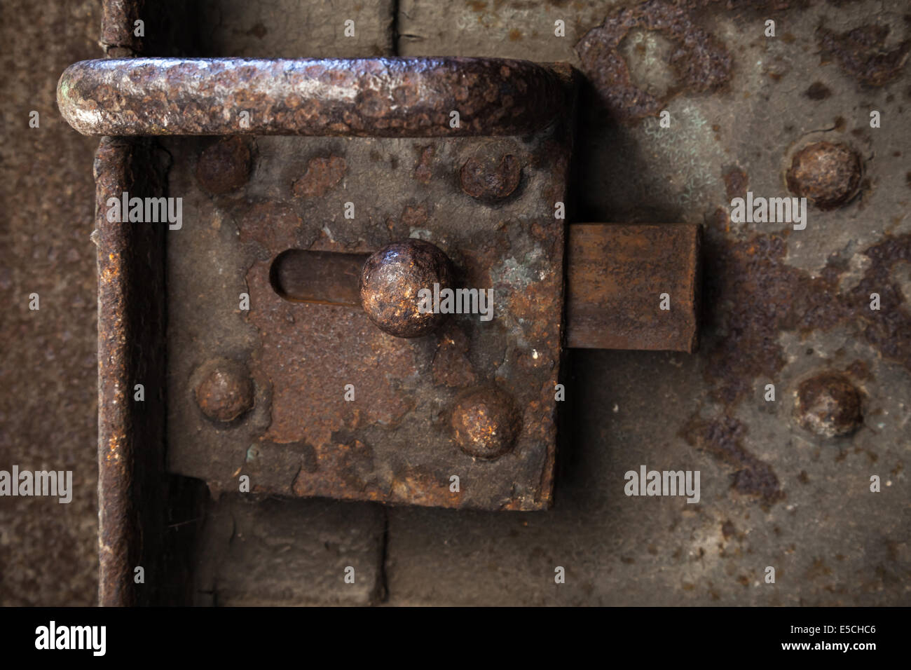 Old rusted lock on dark steel door Stock Photo - Alamy