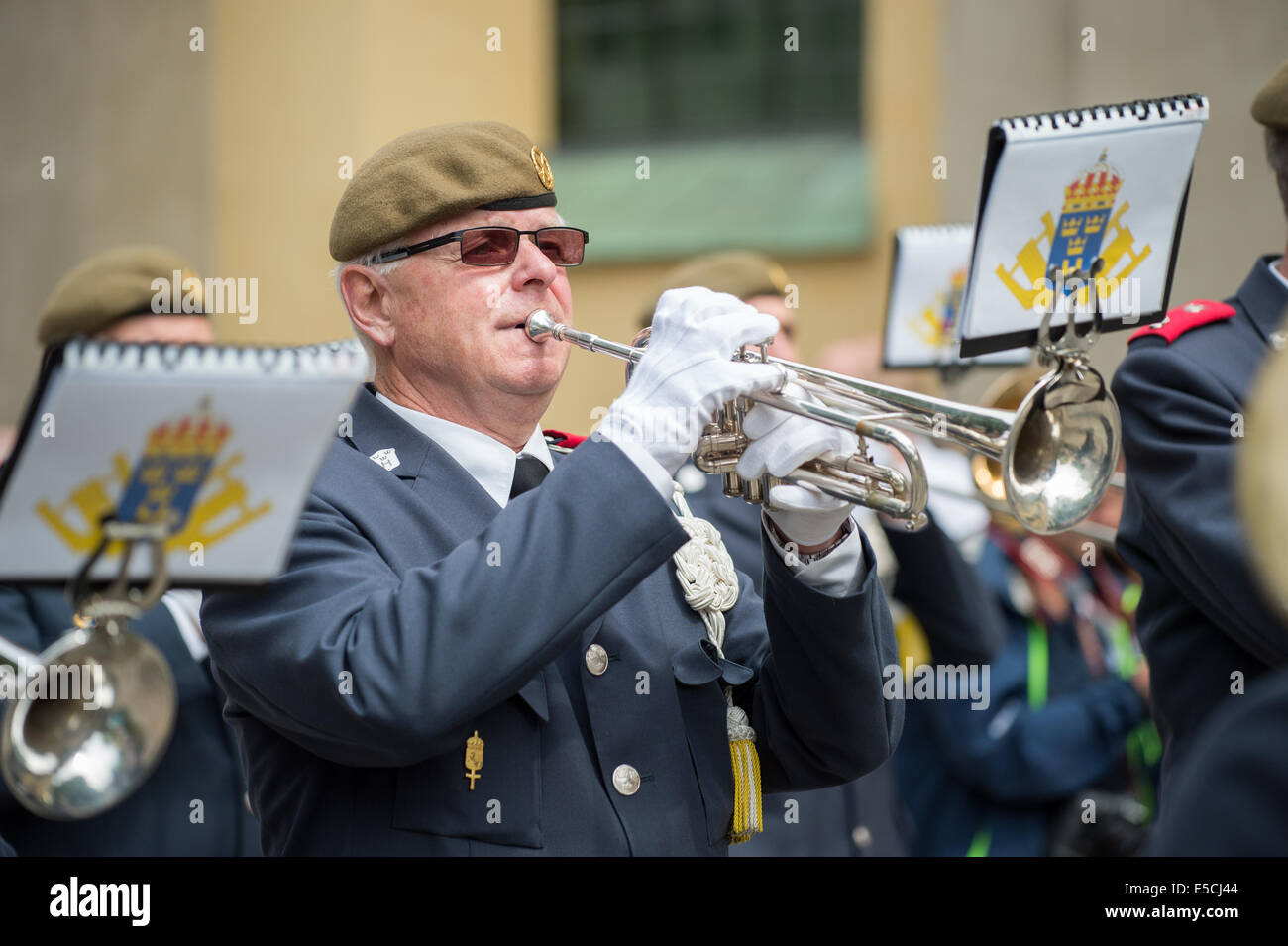 Male trumpet player in a military orchestra playing during National day ...