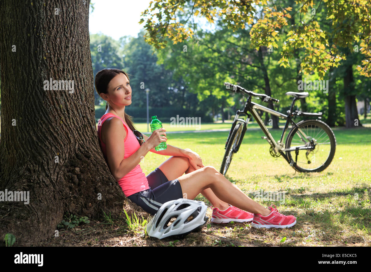 Woman taking bike hi-res stock photography and images - Alamy