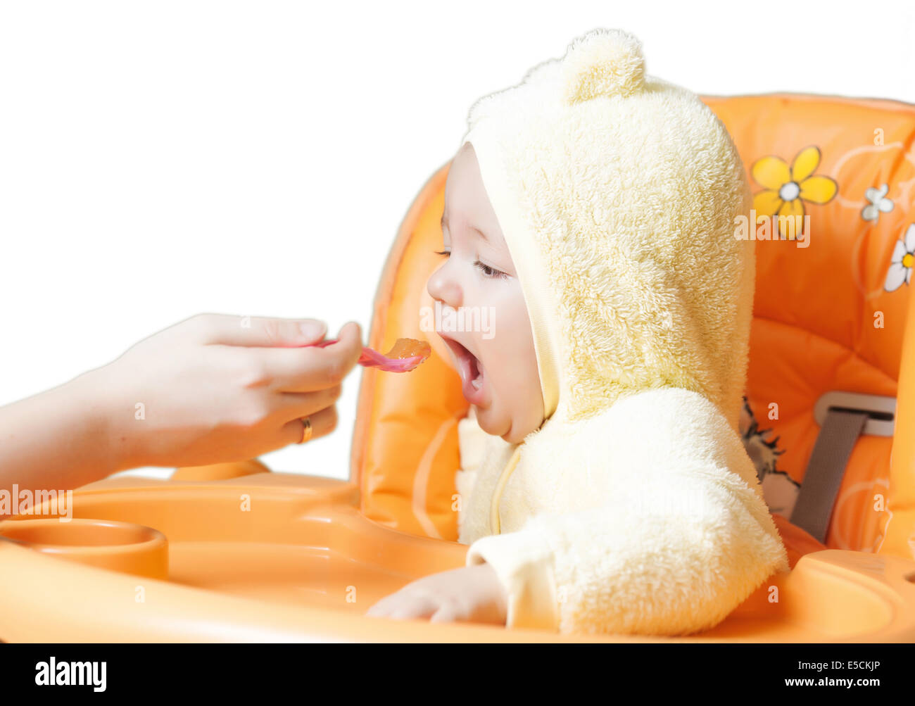 feeding cute baby boy isolated on white background Stock Photo - Alamy