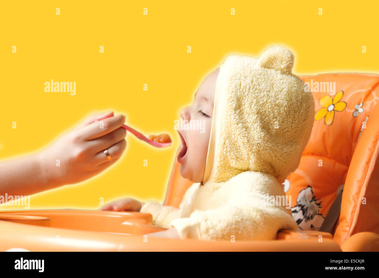 feeding cute baby boy isolated on white background Stock Photo - Alamy