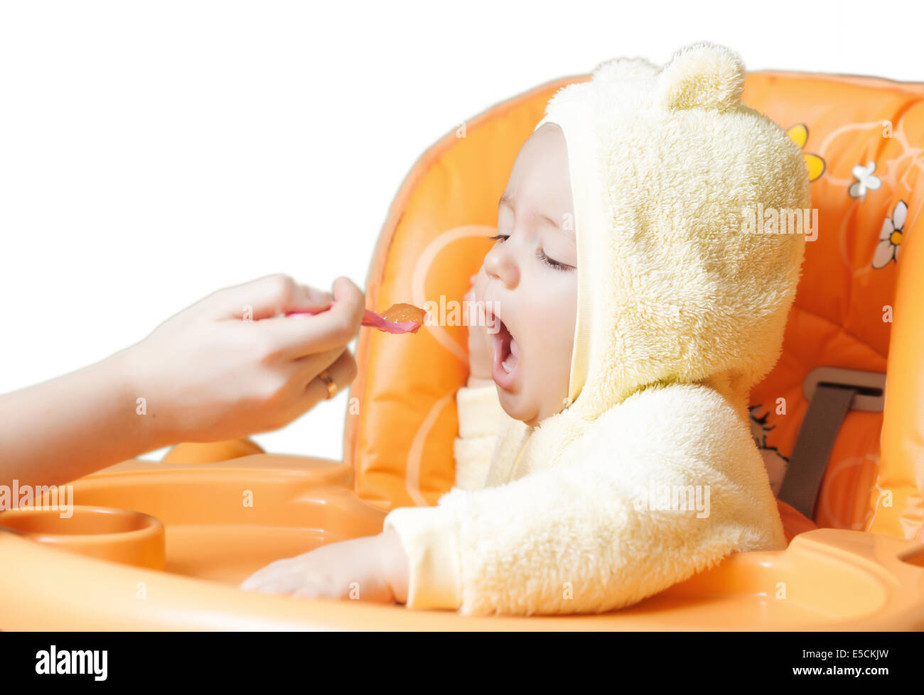 feeding cute baby boy isolated on white background Stock Photo - Alamy