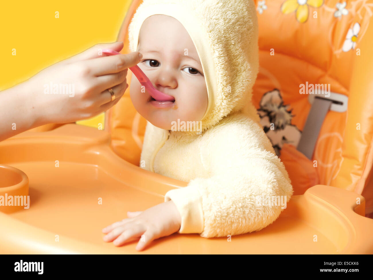 feeding cute baby boy isolated on white background Stock Photo - Alamy