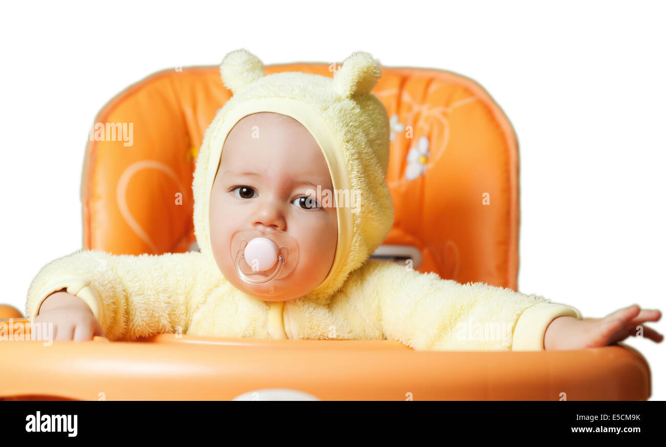 The child sits in a baby chair isolated on white background Stock Photo ...
