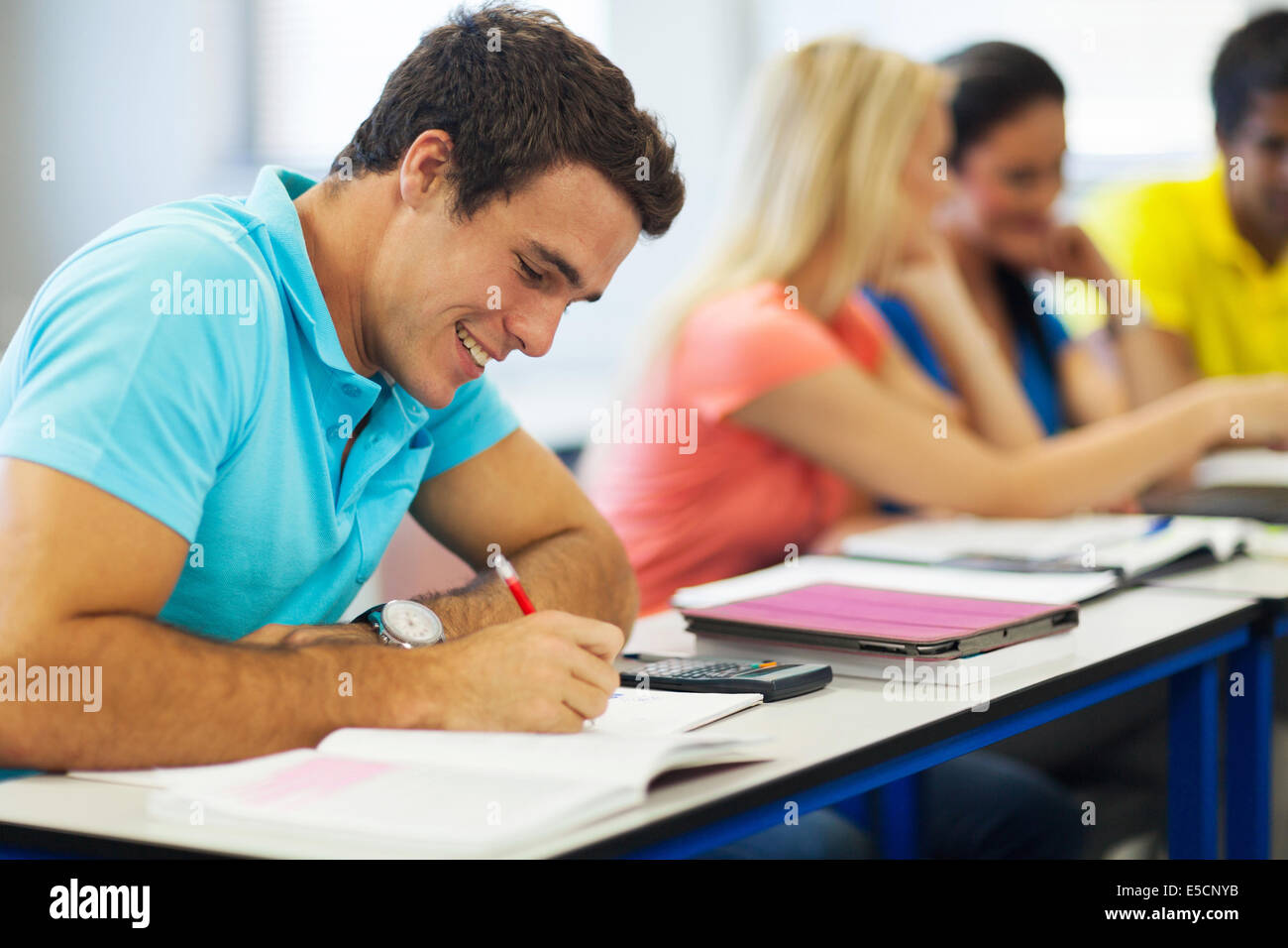cheerful male uni student studying in lecture room Stock Photo - Alamy
