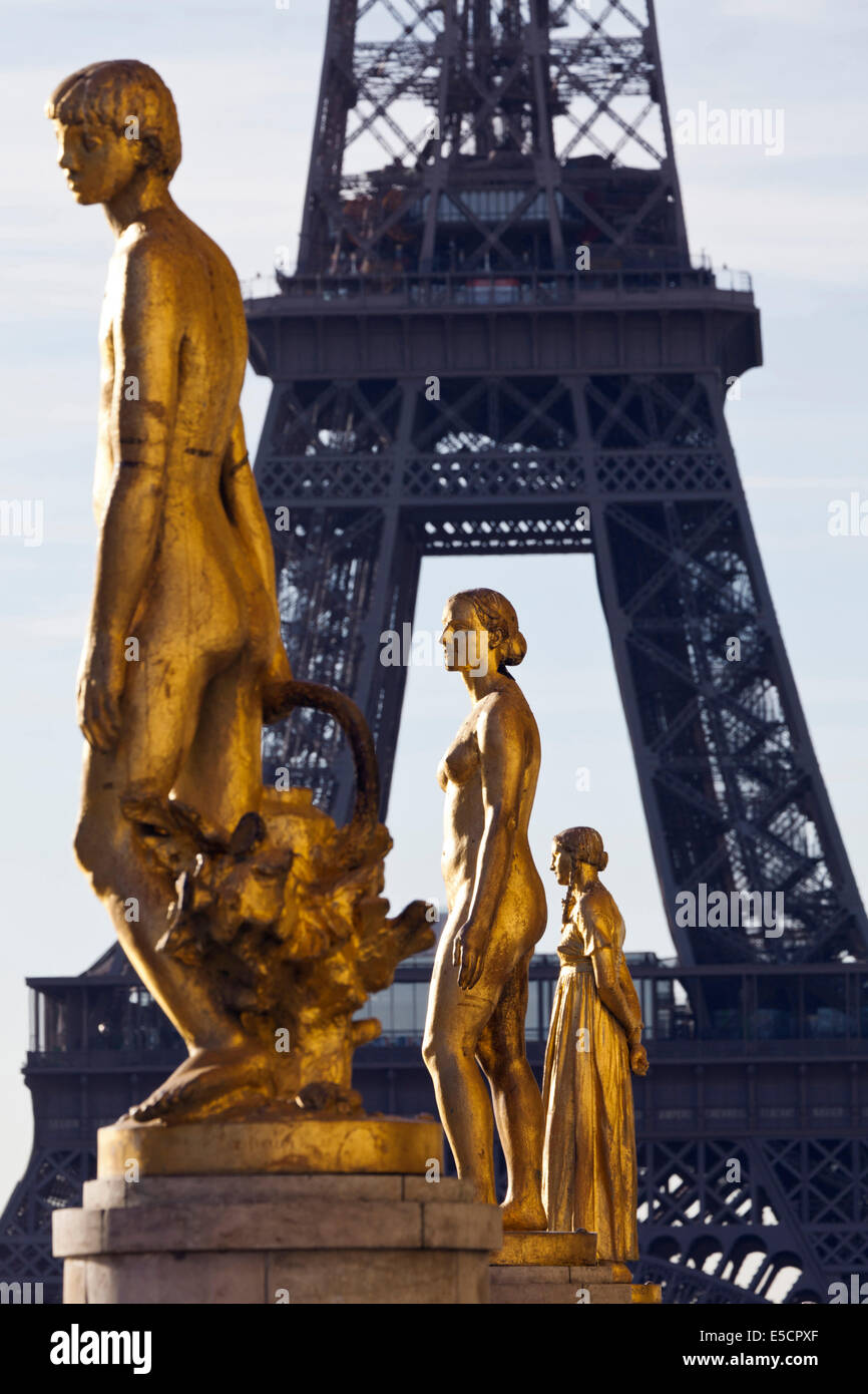 Gilded bronze statues of the Palais de Chaillot with the Eiffel Tower ...