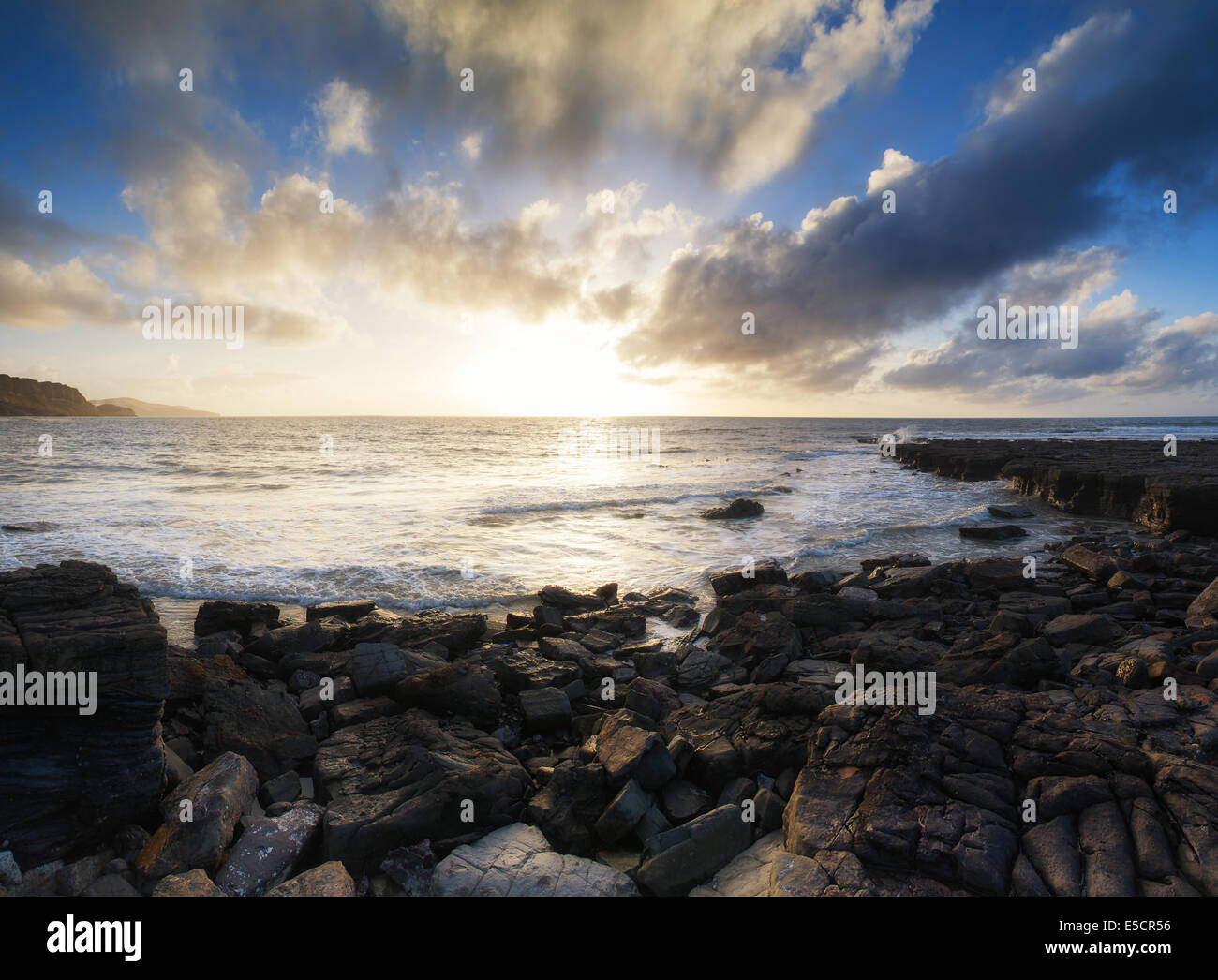 Stunning landscape ocean at sunset dramatic clouds Stock Photo - Alamy
