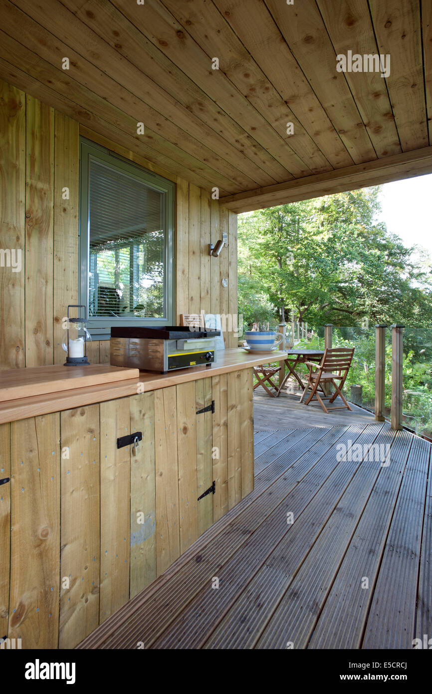 Exterior, the outside cooking area on the covered deck Stock Photo - Alamy