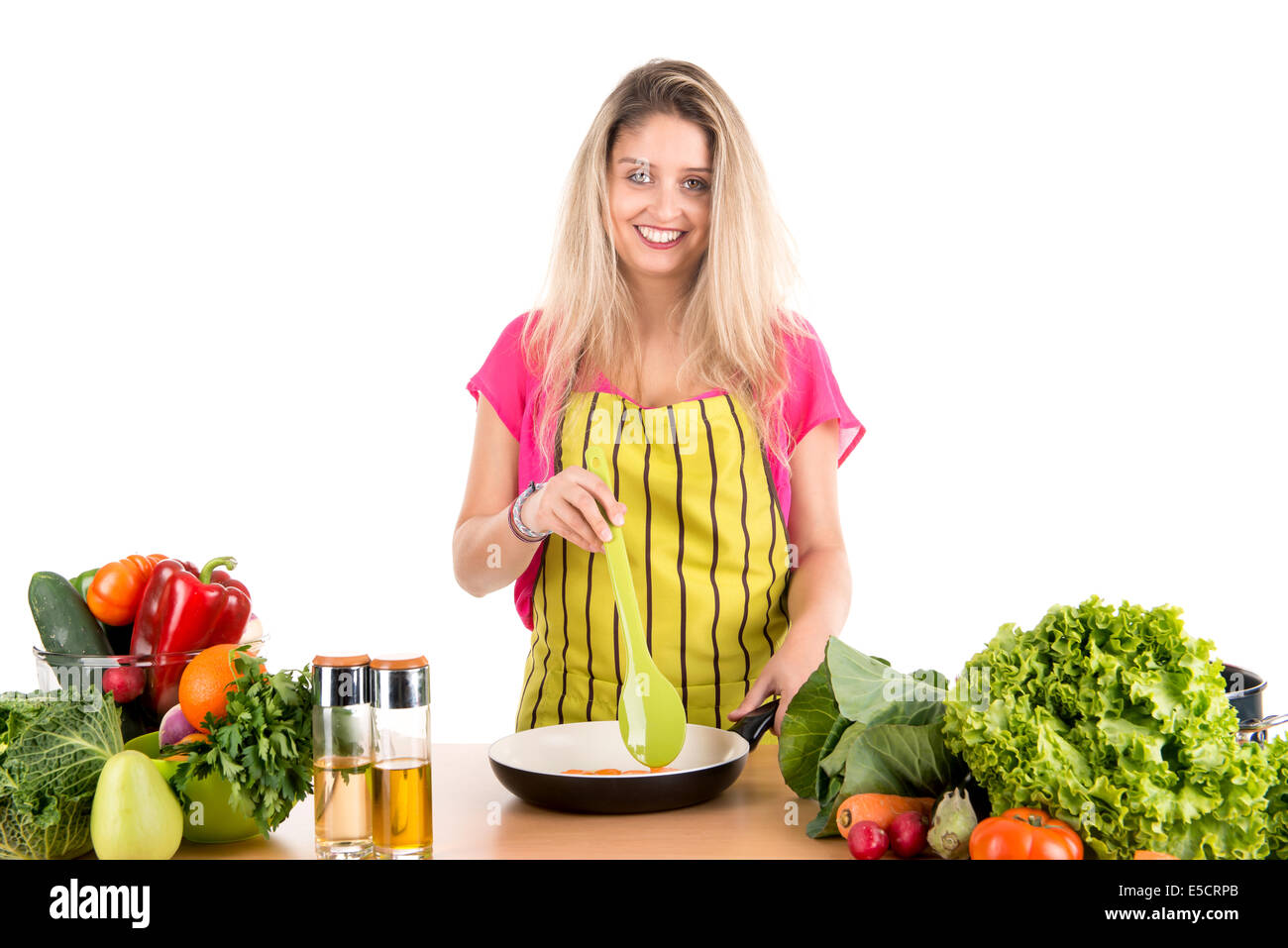 Beautiful woman cooking in the kitchen Stock Photo - Alamy