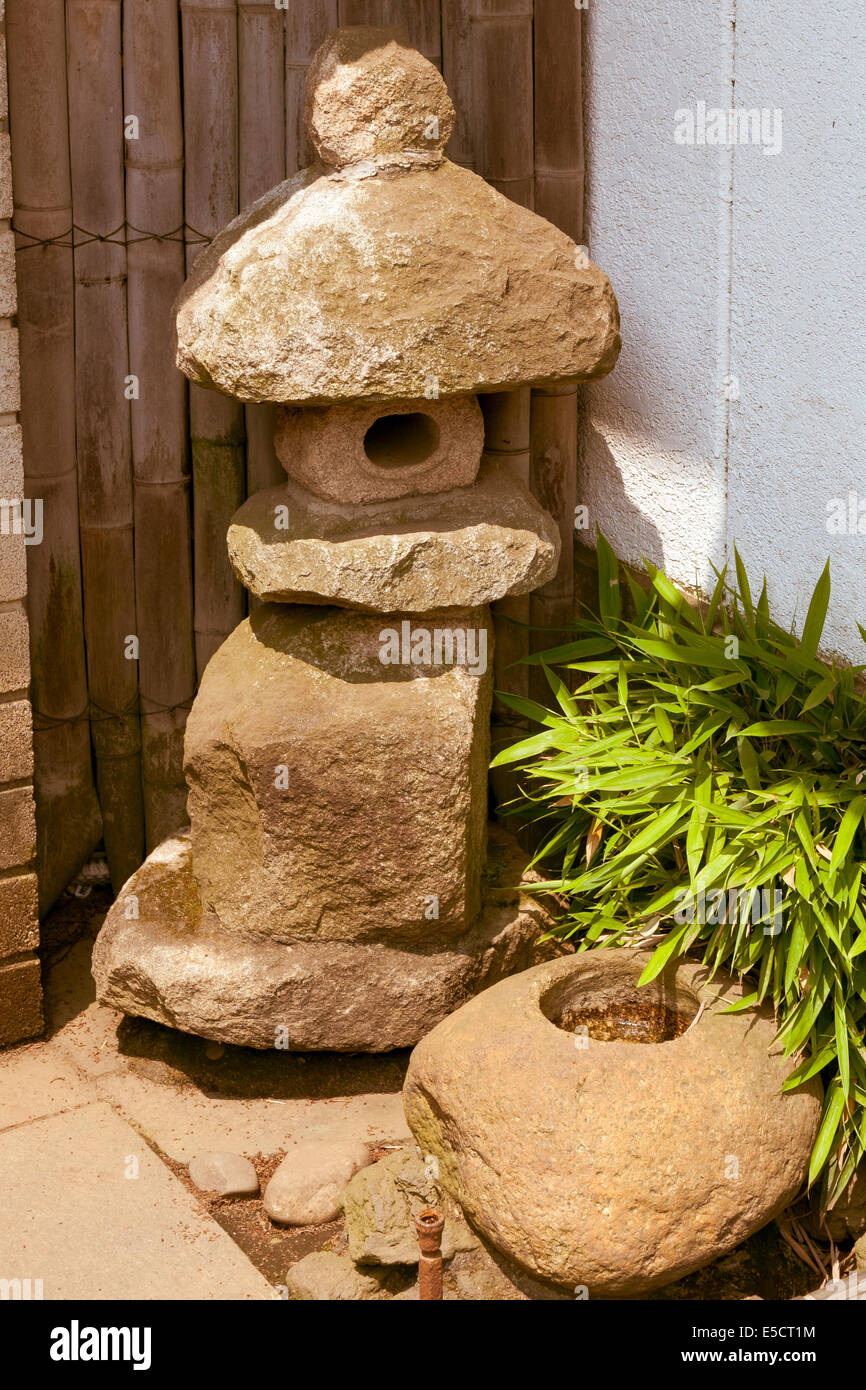 traditional small stone lantern near Japanese house Stock Photo - Alamy