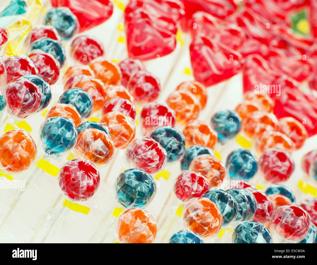 Background of many colorful sweet lollipops Stock Photo - Alamy