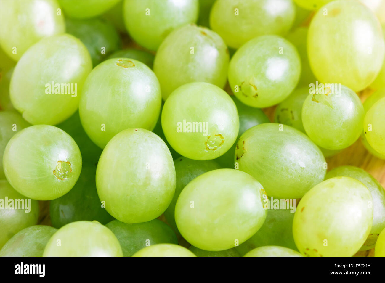 Sweet green grapes background closeup Stock Photo - Alamy